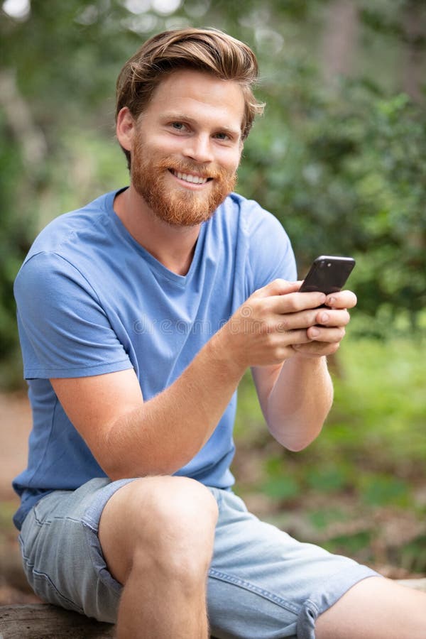 Happy Young Man Using Phone Stock Image - Image of gadget ...
