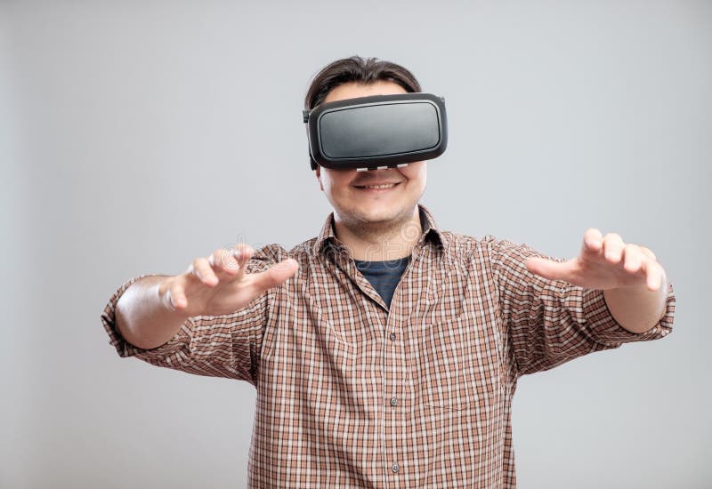 Happy Young Man Using Virtual Reality Headset Stock Image - Image of ...