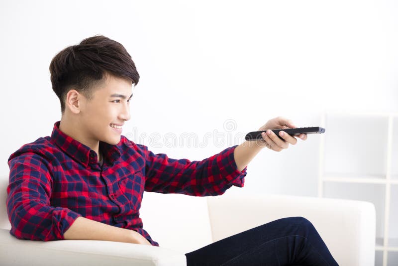 Happy Young Man Watching Tv on the Sofa Stock Photo - Image of japanese ...