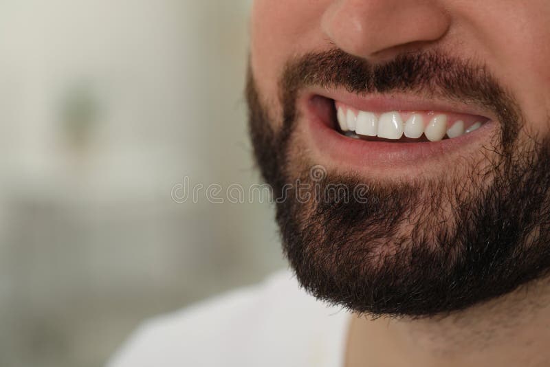 Happy Young Man with White Teeth on Blurred Background, Closeup Stock ...