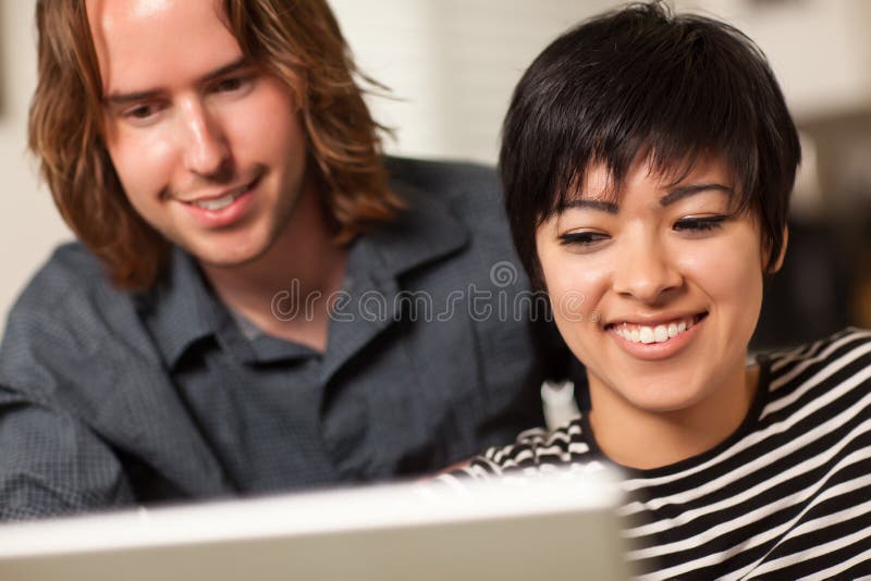 Happy Young Man and Woman Using Laptop Together Stock Photo - Image of ...