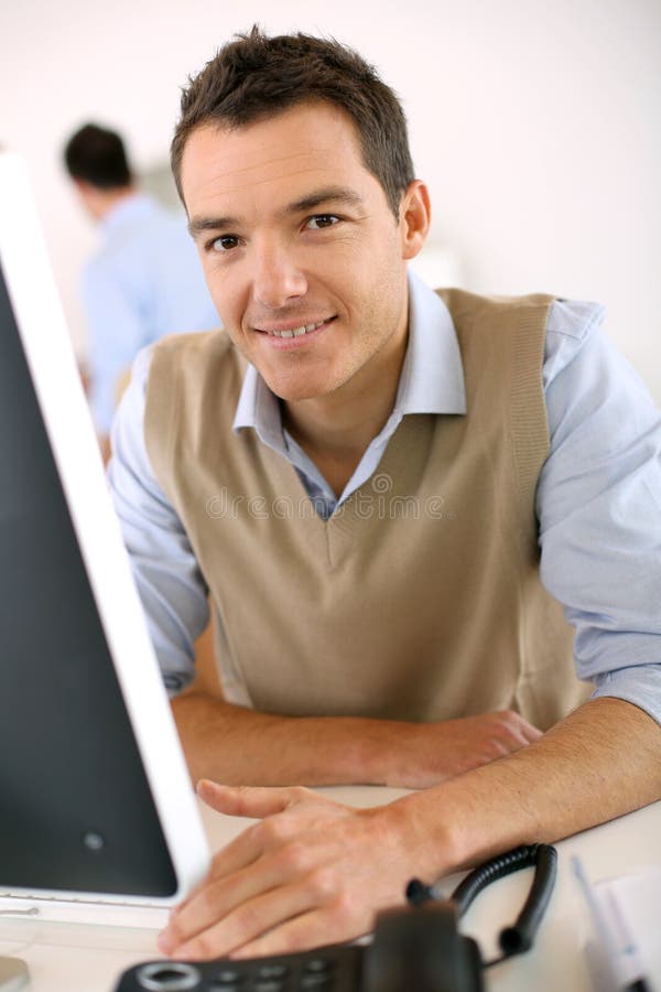 Happy Man in Office Sitting in Front of Computer Stock Image - Image of ...