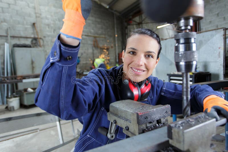 Happy Young Mechanic Apprentice Working on Milling Machine Stock Image ...