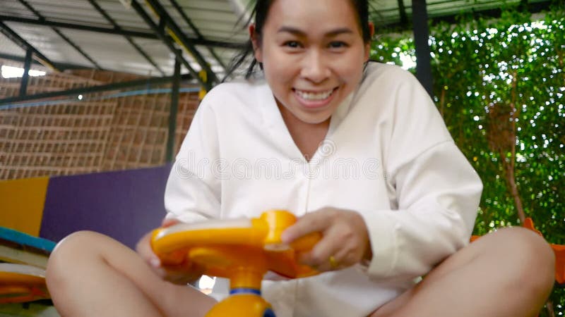 Happy Young Mother Having Fun To Play Toy Car In The Playground Stock