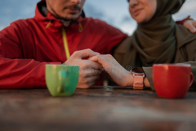 A Happy Young Muslim Couple are Drinking a Cup Coffee Outside. Stock ...