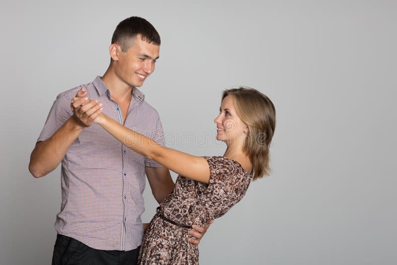 Happy Young People in a Dance Pose Stock Image - Image of love, pretty ...