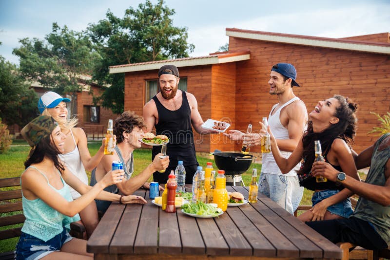 Happy Young People Laughing and Having Fun on Barbeque Party Stock ...