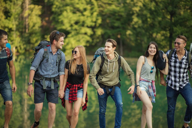 Happy Young People are Strolling in the Forest Stock Photo - Image of ...