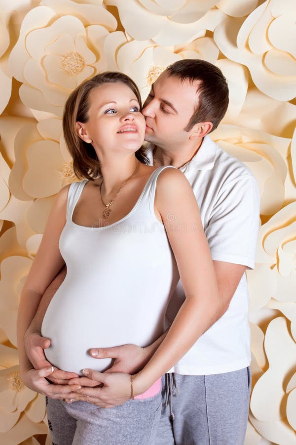 Happy and Young Pregnant Couple Hugging Stock Image - Image of body ...