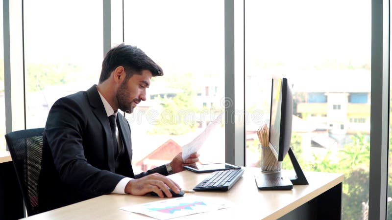 Happy Young Professional Businessman Sitting in Office and Working and ...