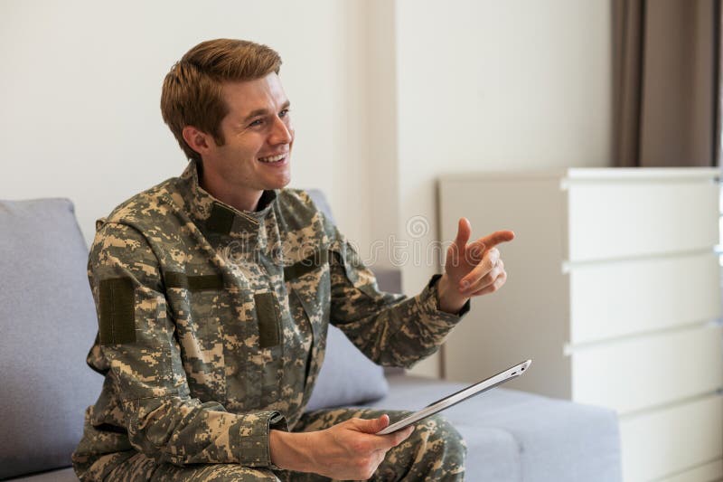 Happy Young Soldier Holding a Computer Tablet Stock Photo - Image of ...