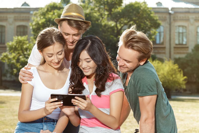 Happy Young Students in the Park Stock Image - Image of women, teenage ...