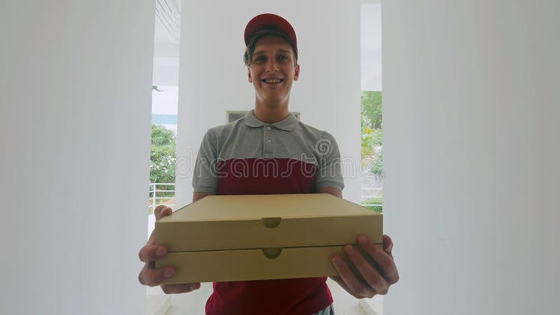 Happy Young Trainee Delivers the First Order of Pizzas. Stock Image ...