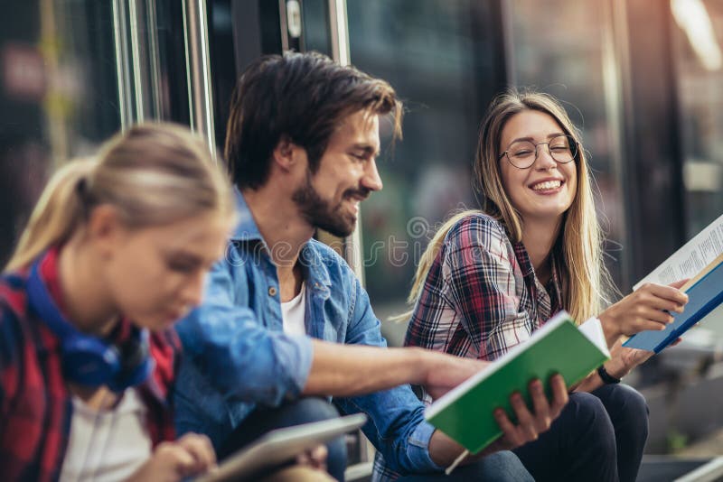Young University Students Friends Studying with Books at University ...
