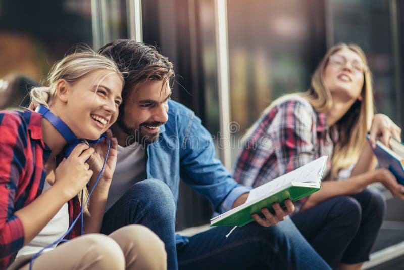 Young University Students Friends Studying with Books at University ...