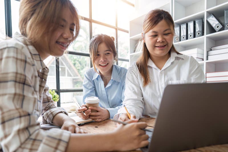 Happy Young University Students Studying with Books in Library. Group ...