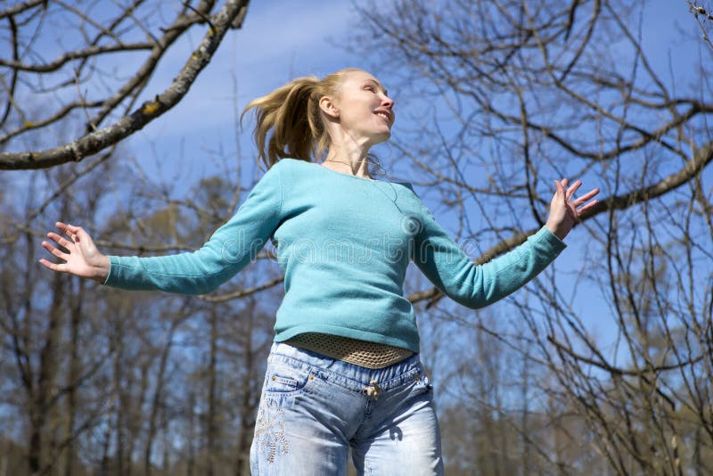 Happy Young Woman in Bright Clothes Jumps in Spring Park Stock Image ...