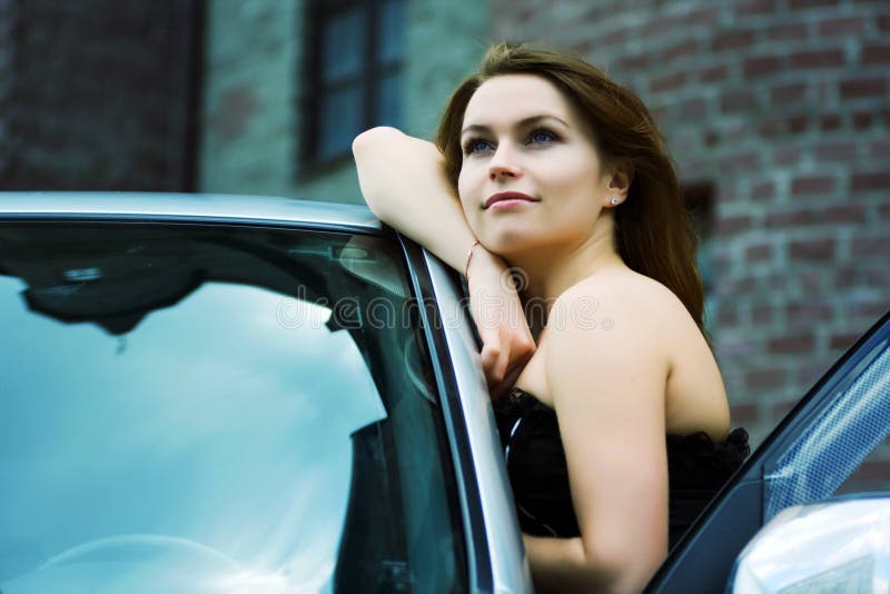 Rusty Old Auto with Young Woman Inside Stock Image - Image of junker ...