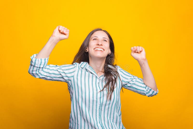 Happy Young Woman Cheering Up with Both Her Hands Up Stock Image ...