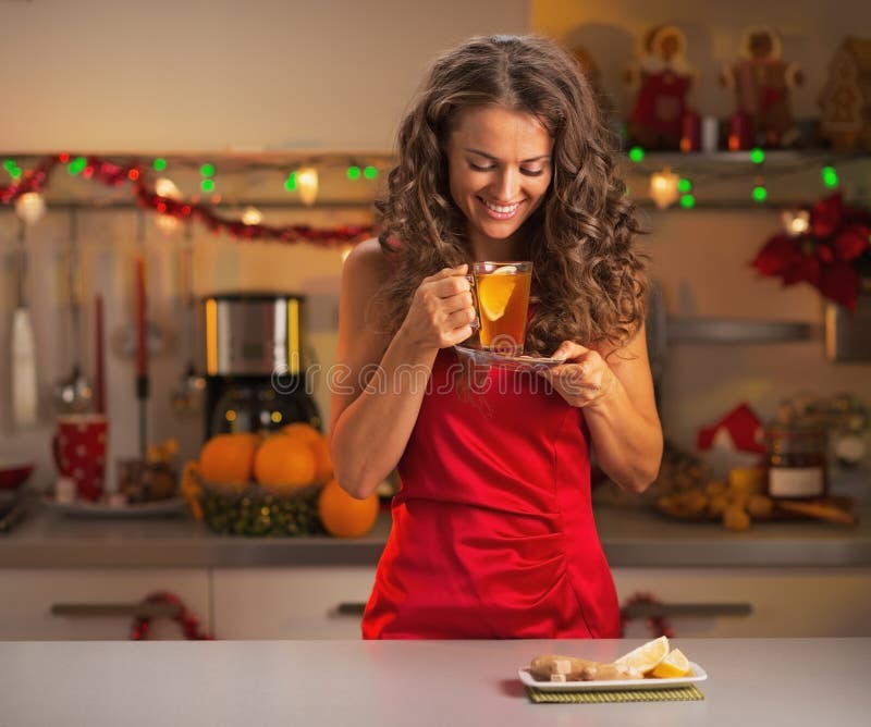Happy Young Woman Drinking Ginger Tea in Kitchen Stock Image - Image of ...