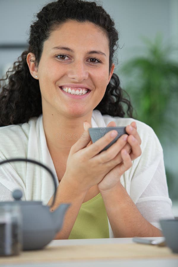Happy Young Woman Drinking Tea Stock Photo - Image of portrait, resting ...