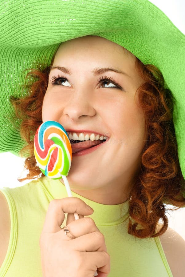 Happy Young Woman Eating a Candy Stock Photo - Image of happiness ...
