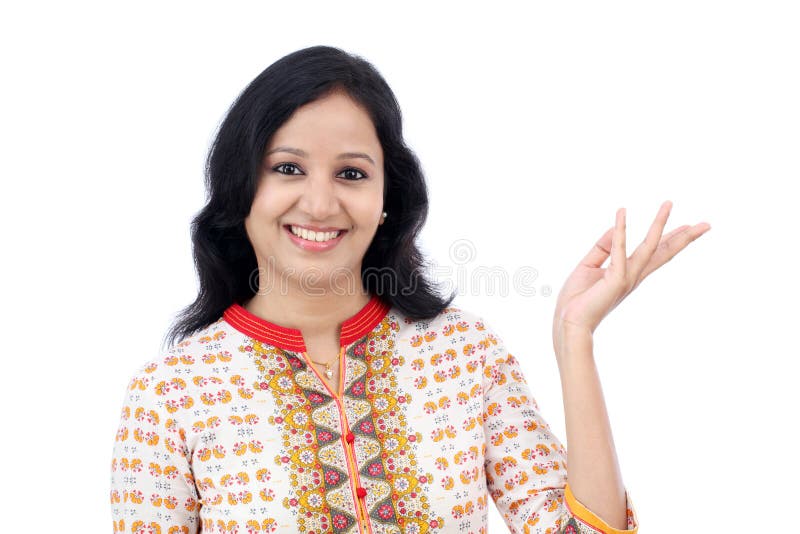 Happy Young Woman Gesturing An Open Hand Against White Stock Image ...