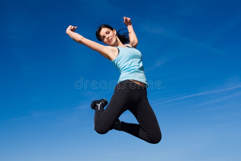 Happily Jumping Fit Attractive Woman Stock Photo - Image of ...