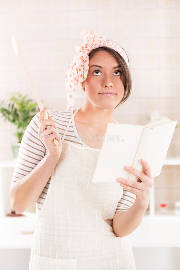 Happy Young Woman in the Kitchen Stock Image - Image of spoon, thinking ...