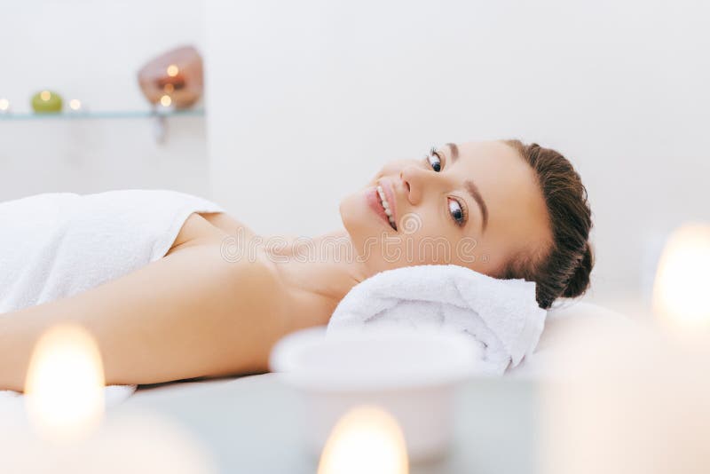 Happy Young Woman Relaxing on Massage Table Stock Image - Image of ...
