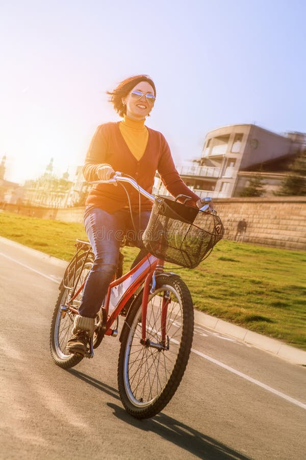 Woman Riding a Bicycle in a Park Outdoor at Summer Day. Active People ...