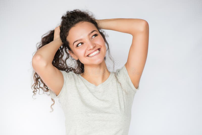 Happy Young Woman Smiling and Looking at One Side Stock Photo - Image ...