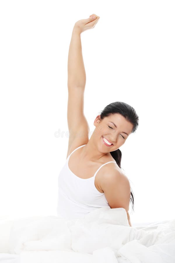 Happy Young Woman Stretching in Bed Stock Photo - Image of carefree ...