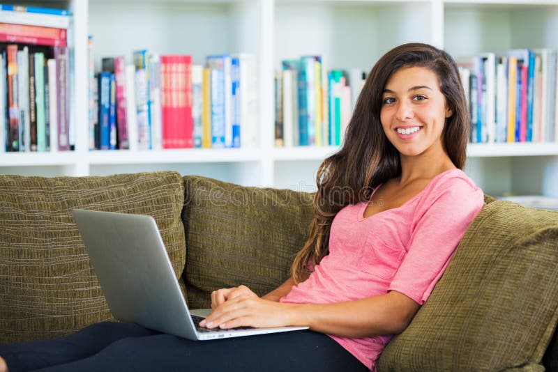 Happy Young Woman Using a Laptop Computer Stock Image - Image of couch ...