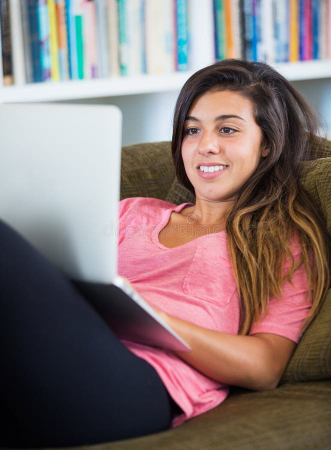 Happy Young Woman Using a Laptop Computer Stock Photo - Image of ...