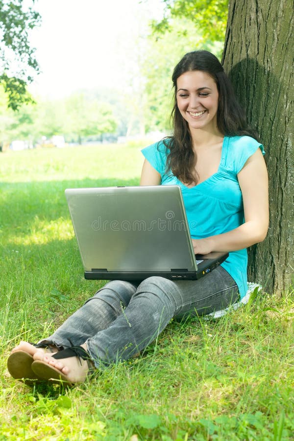 Happy Young Woman Using Laptop Outdoors Stock Photo - Image of ...