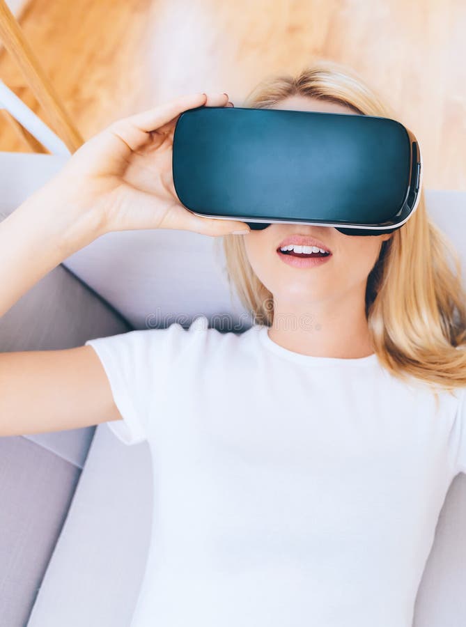 Happy Young Woman Using a Vr Headset Stock Photo - Image of game, relax ...