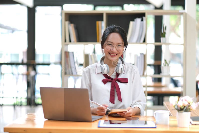 Happy Young Woman Wearing Wireless Headphone Having Learning Online at ...
