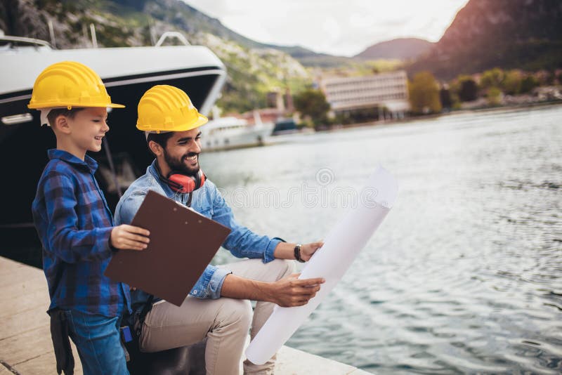 Harbor Engineer with His Son Holding the Paper, Construction Work Stock ...