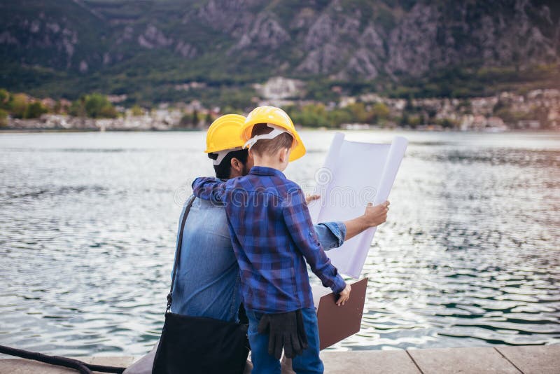 Harbor Engineer with His Son Holding the Paper, Construction Work Stock ...
