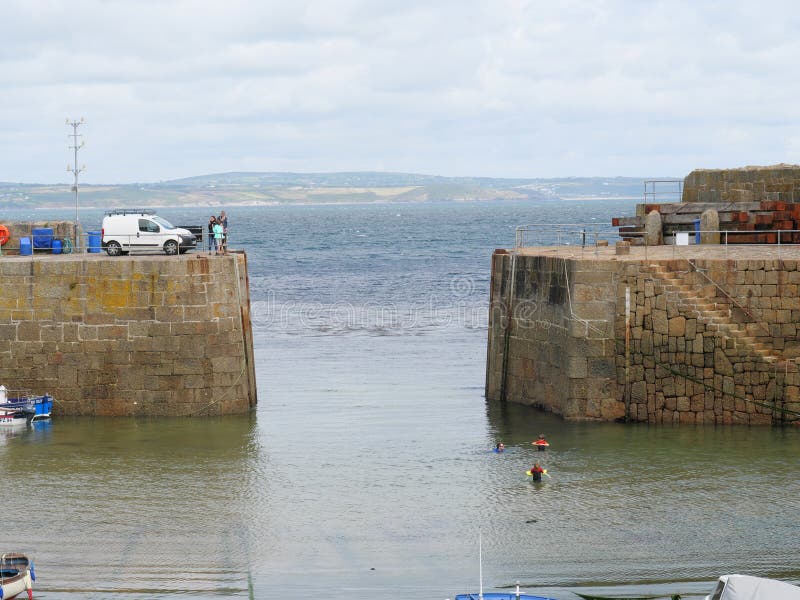 Harbor Entrance and Pier in the Harbor of Mousehole in Cornwall England ...