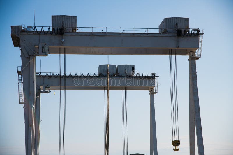 Harbor Gantry Crane Moving a Tank Container Stock Image - Image of ...