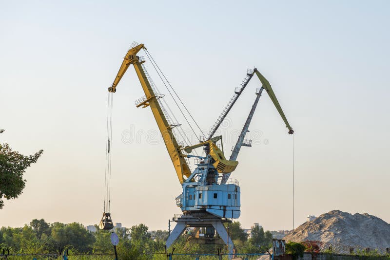 Harbour Cranes are Loading Sand and Gravel on a Barge. Loading ...