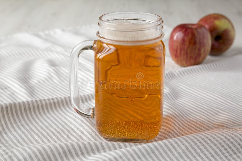 Hard Apple Cider Ale in a Glass Jar Mug on Cloth, Side View. Close-up ...