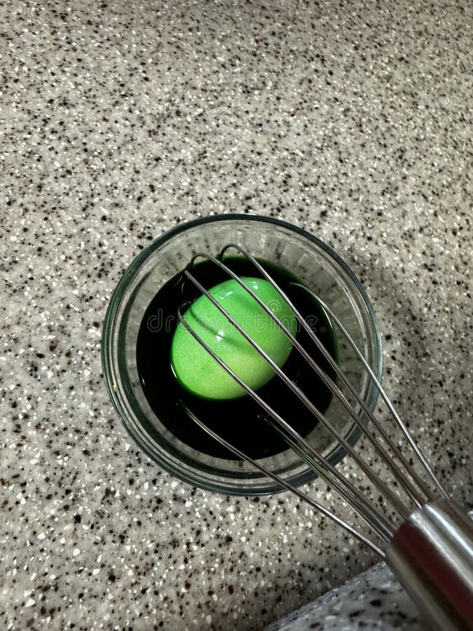 Green Dye Cup with Easter Egg, Wire Whisk for less Messy Stock Image ...