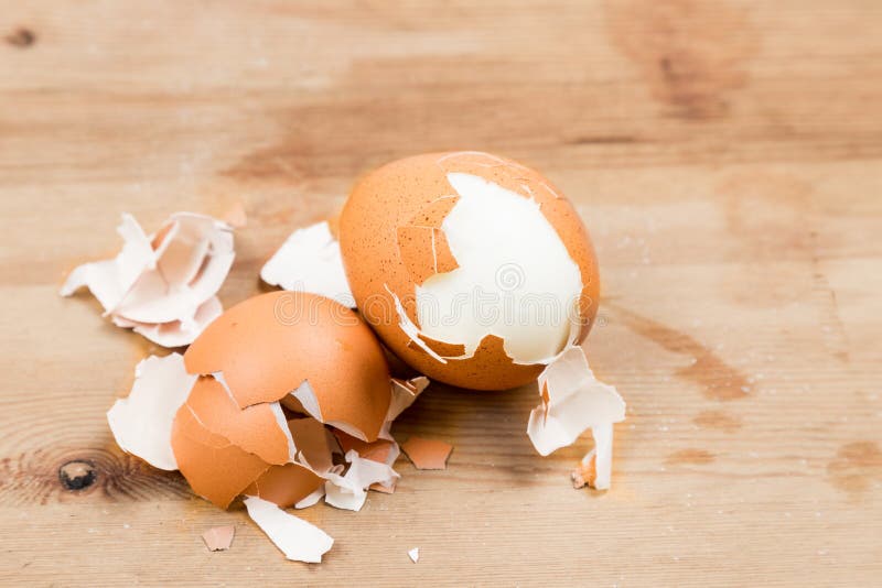Hard Boiled Eggs with Shell Peeled on Wooden Table Stock Photo - Image ...
