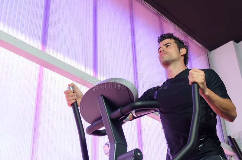 Hard Cardio in Elliptical stock image. Image of treadmill - 25735857
