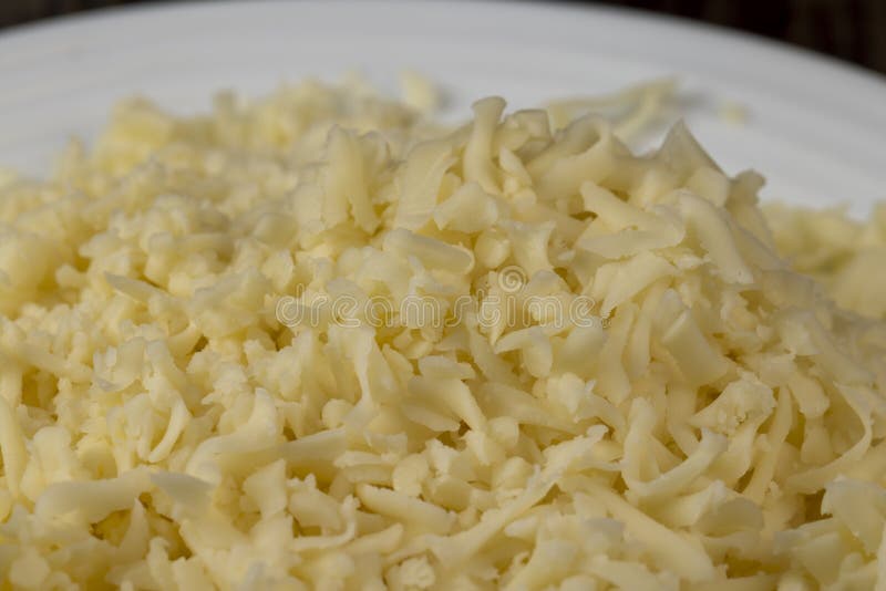 Hard Cheese with Holes Grated into Thin Small Slices Stock Image ...