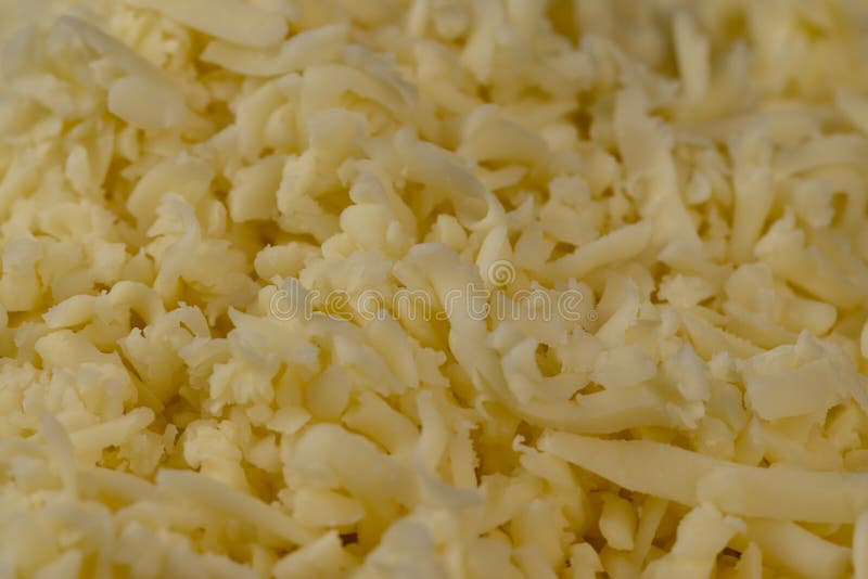 Hard Cheese with Holes Grated into Thin Small Slices Stock Photo ...