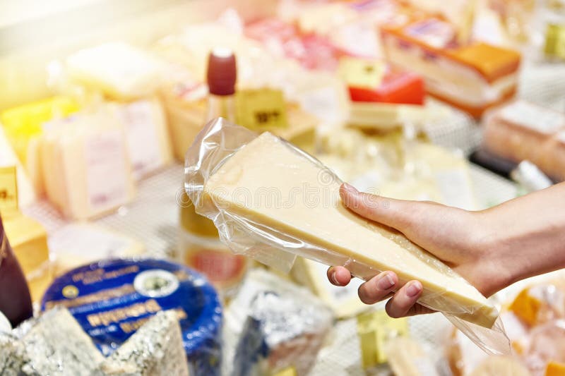 Hard cheese in store stock photo. Image of food, board - 293283602